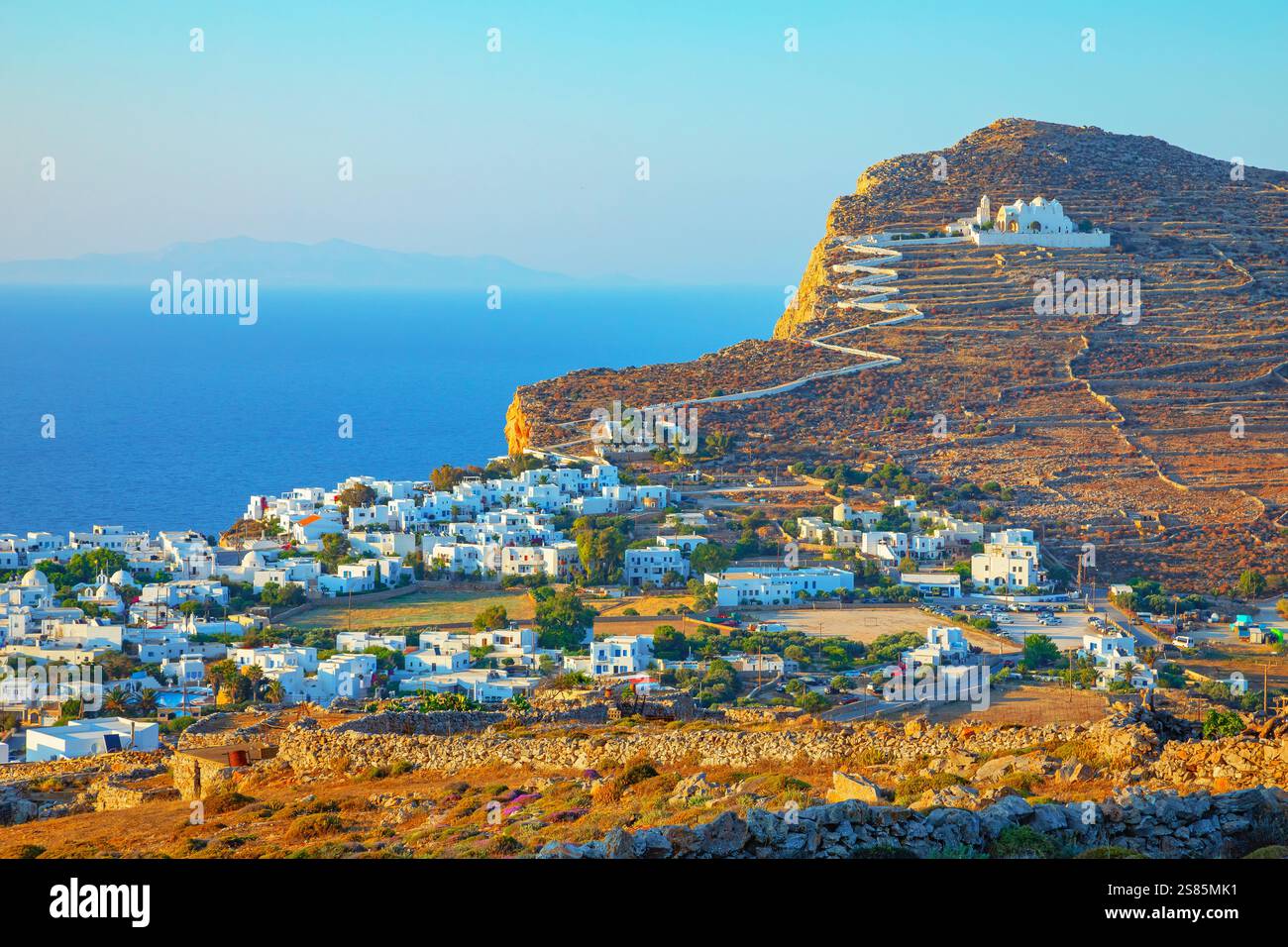 View of Chora village built on a cliff above the sea, Chora ...