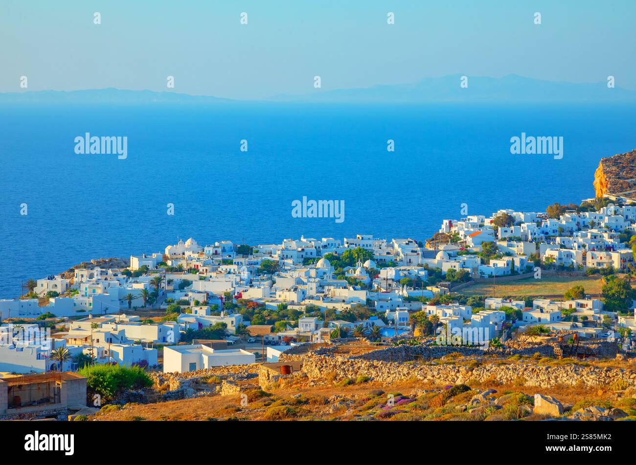 View of Chora village built on a cliff above the sea, Chora ...