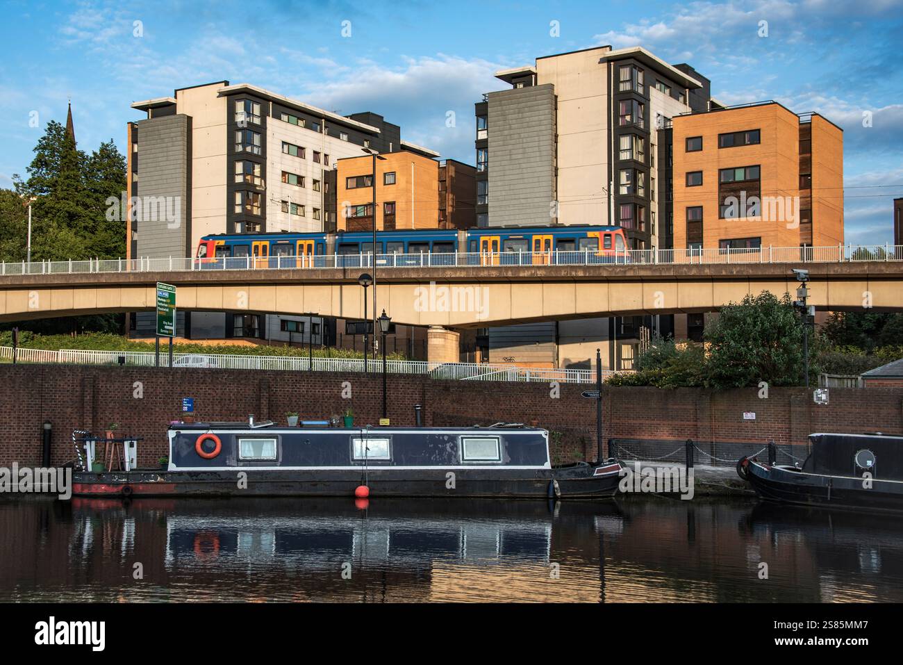 Overhead tram line overlooking canal boats at Victoria Quays, formerly ...