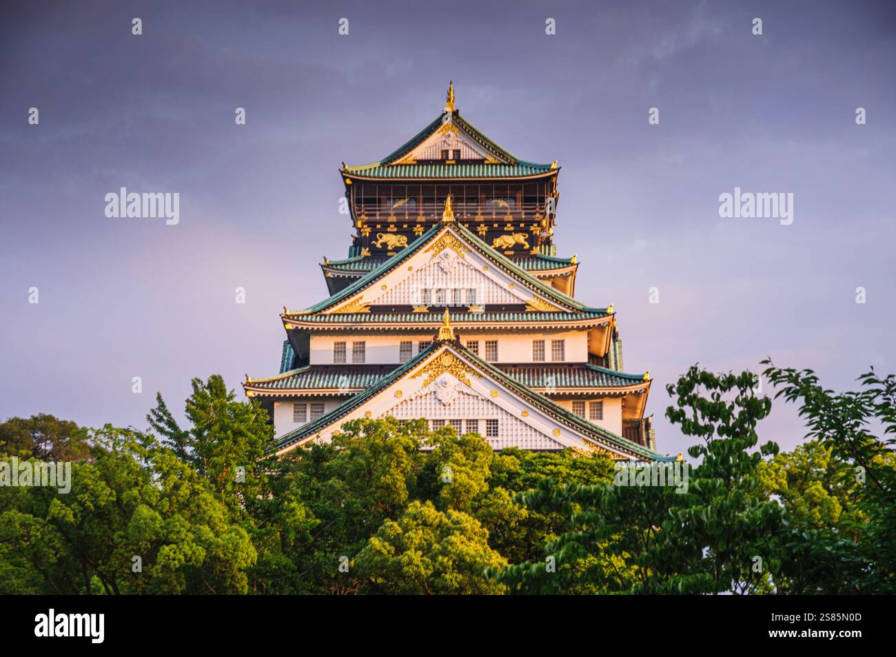 Osaka Castle illuminated at golden hour, Osaka, Honshu, Japan Stock ...