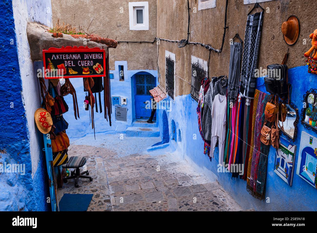 Street with craft goods displays and shops in Chefchaouen (The Blue ...