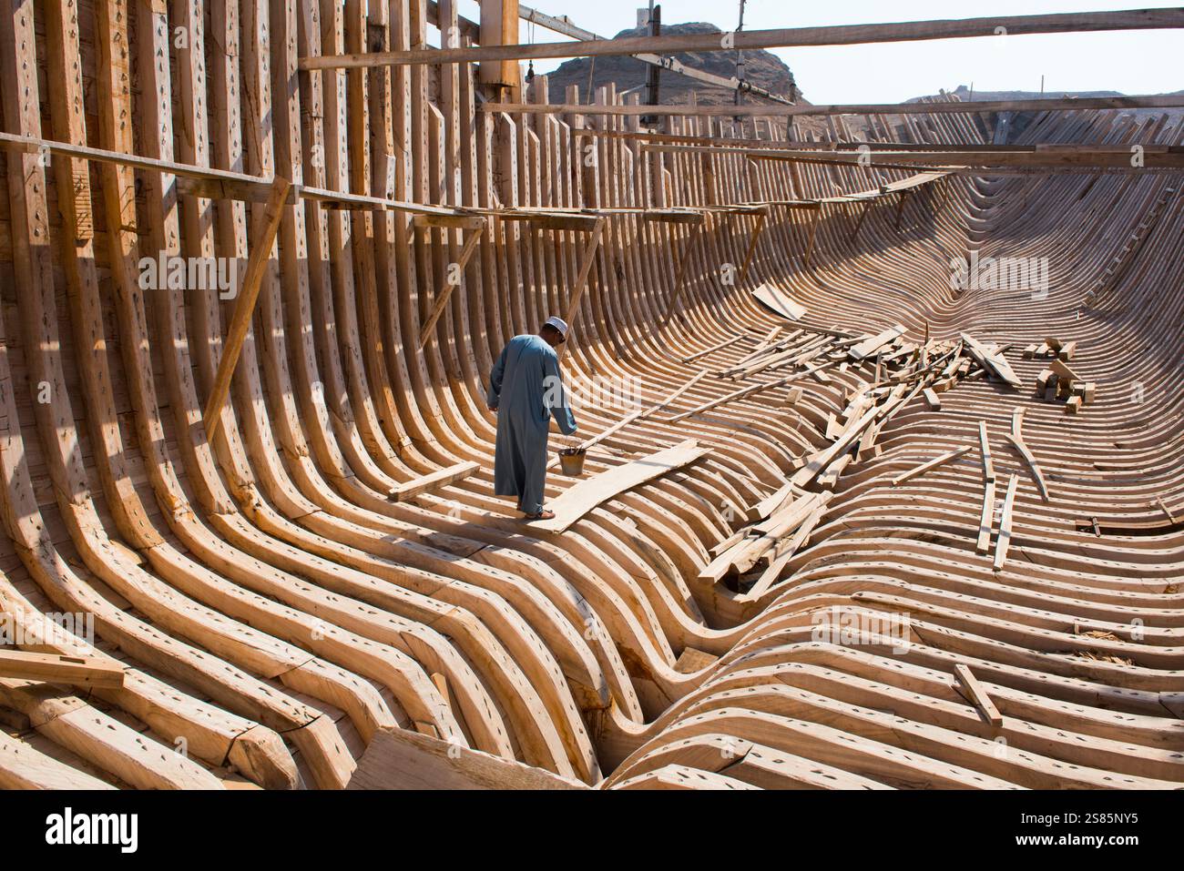 Inner structure in teak wood of dhow under construction in traditional ...