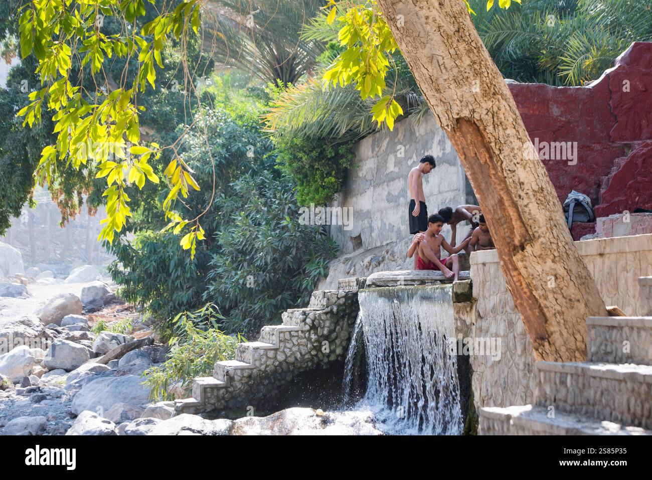 Young men bathing at Al Thowarah (Nakhal Hot springs), Sultanate of ...