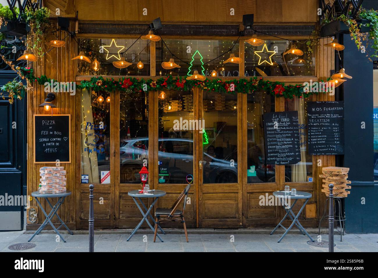 Christmas decorations at a pizza restaurant in Paris, France Stock ...