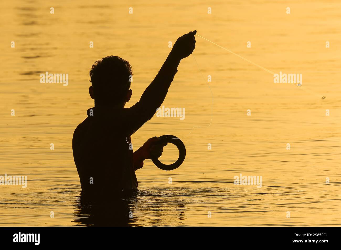 Local man handline fishing at the mangrove fringed Nosara Boca (river ...