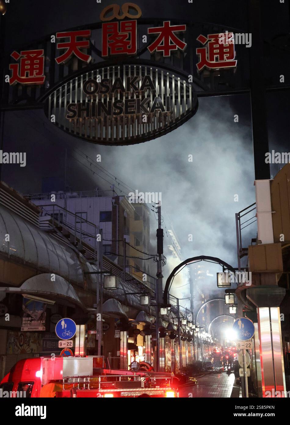 Firefighters work to put out a fire in Osaka, Japan, on January 21 ...