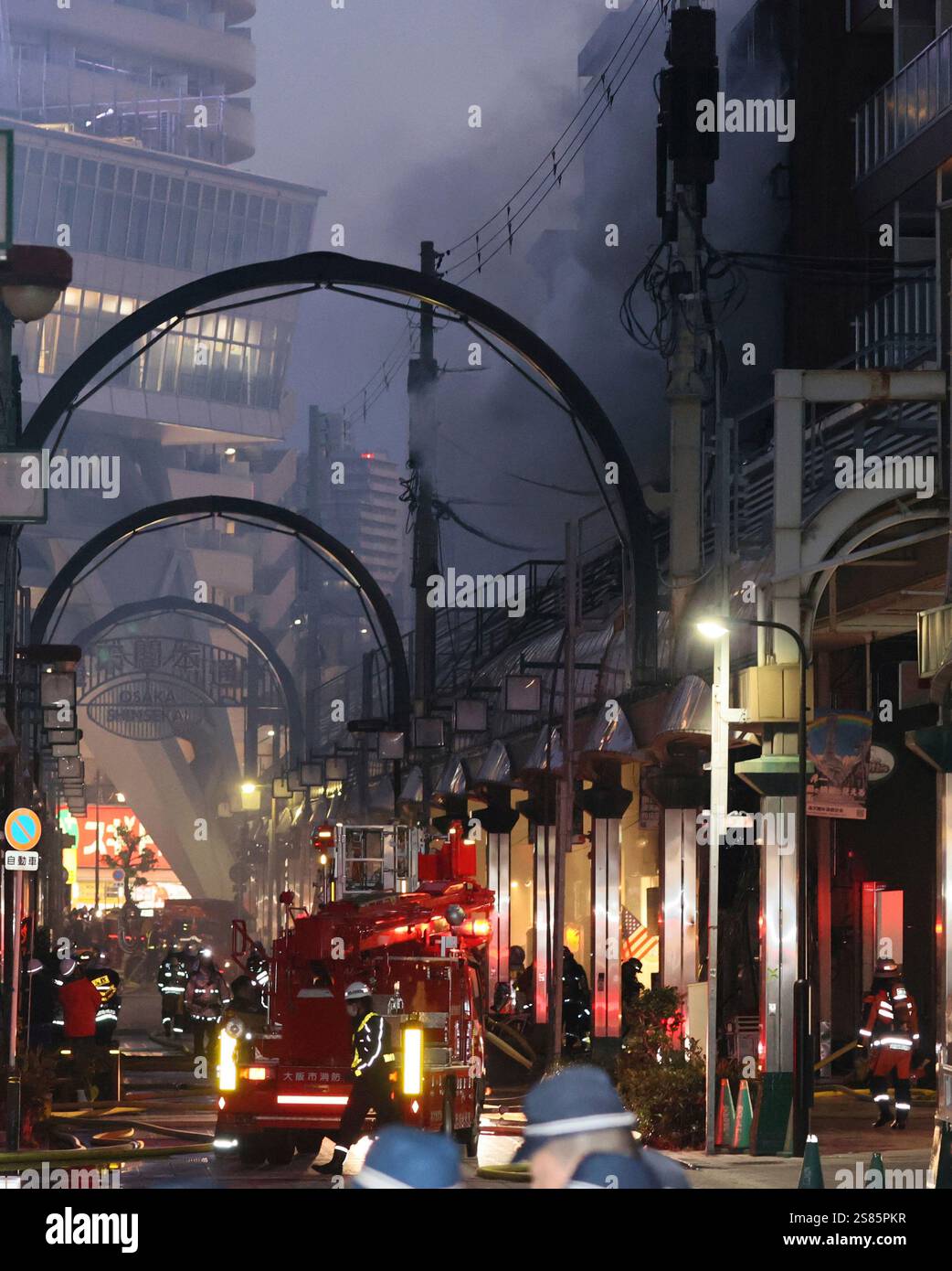 Firefighters work to put out a fire in Osaka, Japan, on January 21 ...