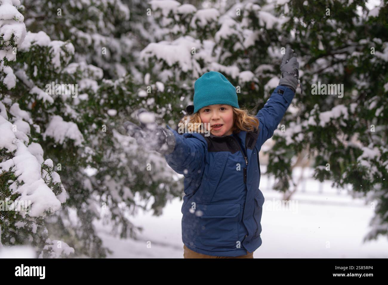 Kids play with snow in winter park. First Winter snow. Kids winters ...
