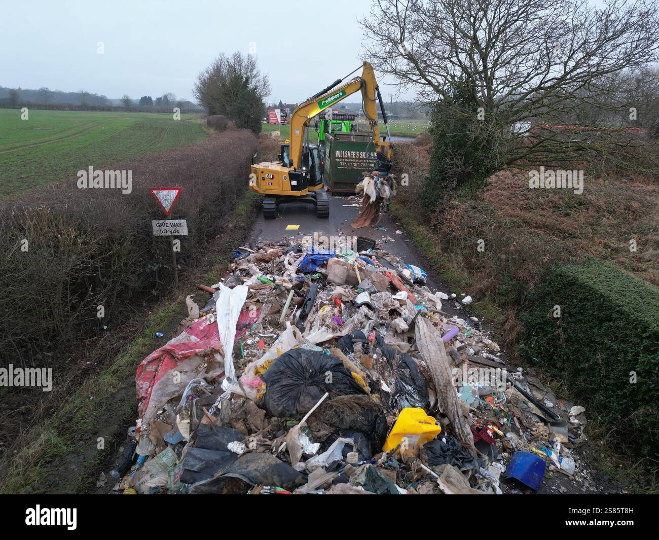 Contractors work to remove the ten-ft-high pile of waste from Watery ...