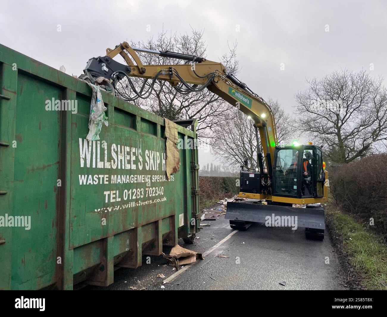 Contractors work to remove the ten-ft-high pile of waste from Watery ...