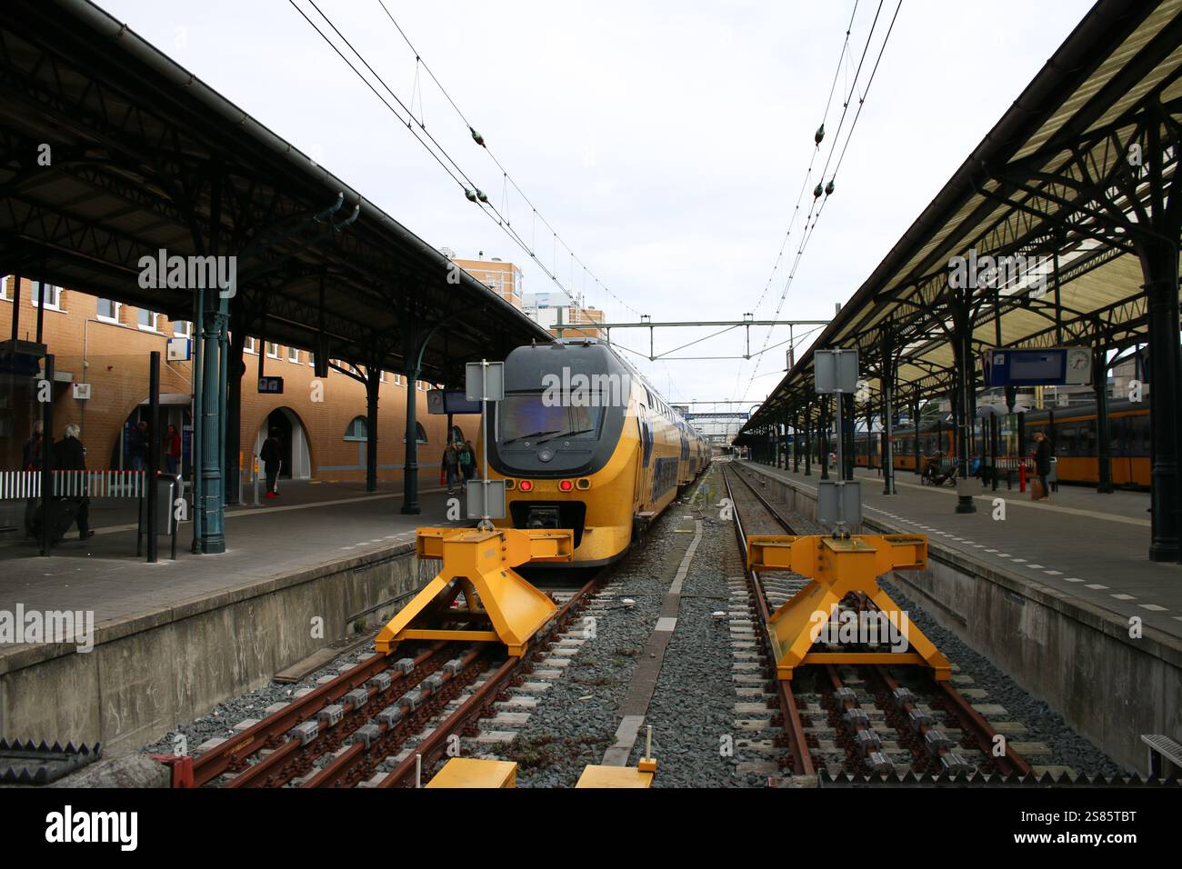 Train, yellow, is waiting for passengers at the central station in ...