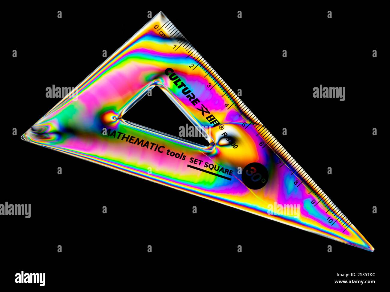 A plastic triangle from a Geometry set, photographed using cross ...