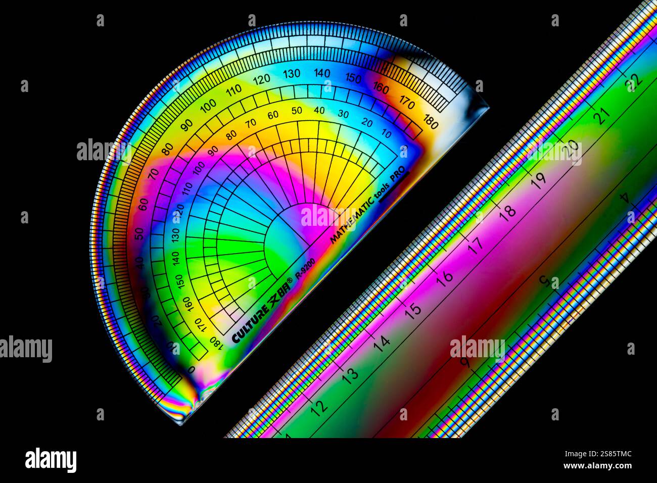 A plastic protractor and a ruler from a Geometry set, photographed ...
