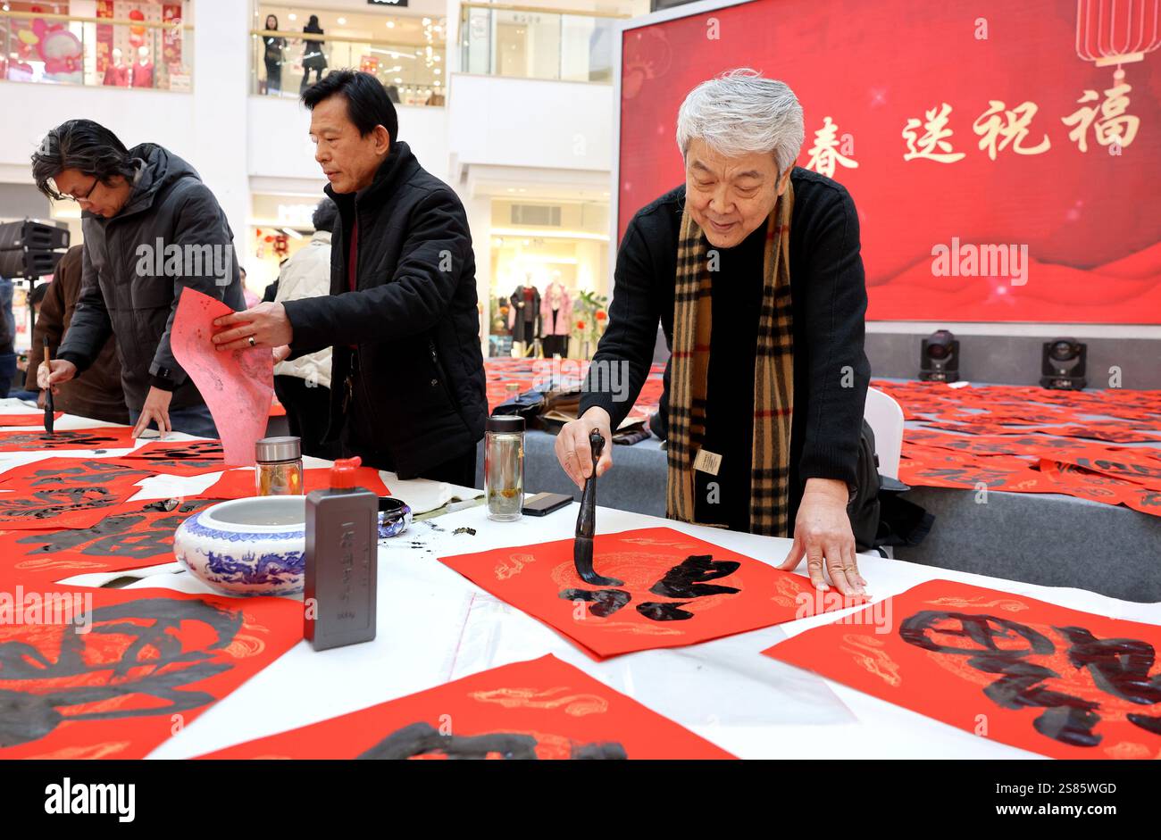 Calligraphy enthusiasts write the character "fu" for citizens at a ...