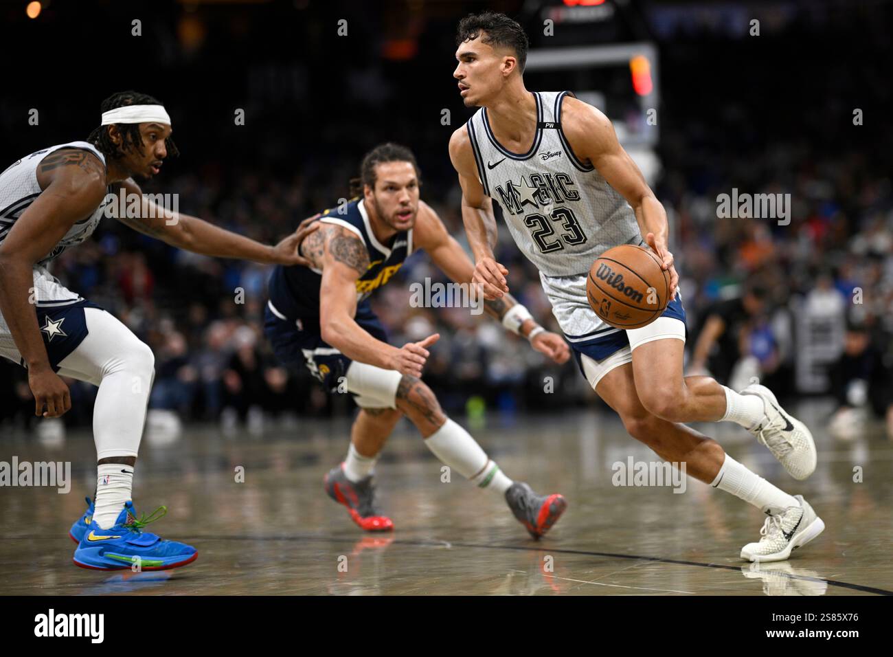 Orlando Magic forward Tristan da Silva (23) drives past Denver Nuggets ...