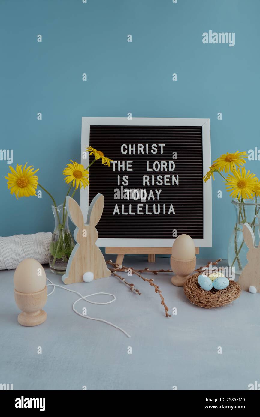 CHRIST THE LORD IS RISEN TODAY ALLELUIA text on letter board with bunny ...