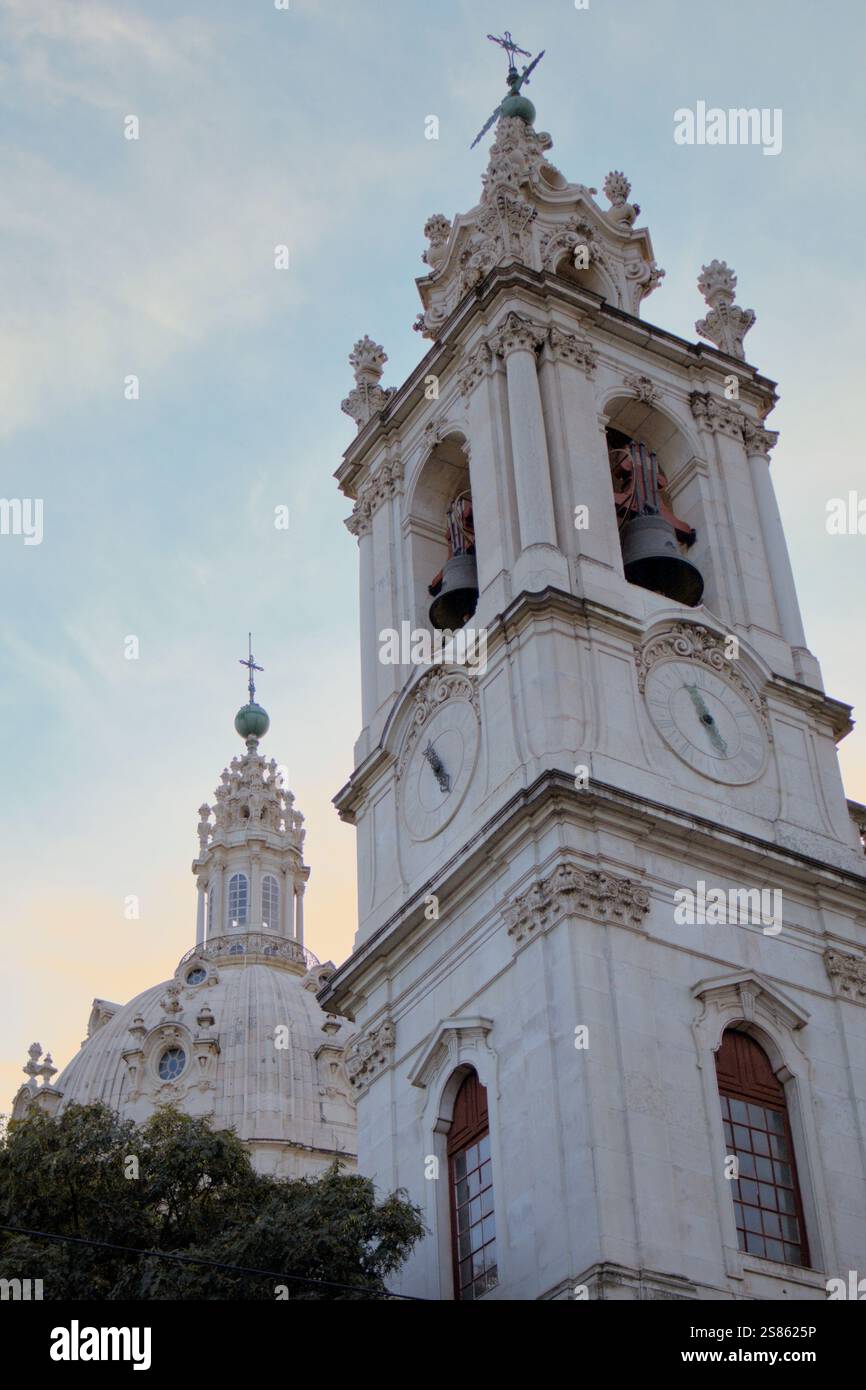 Ground up view of the Basilica da Estrella with a cloudy evening sky ...
