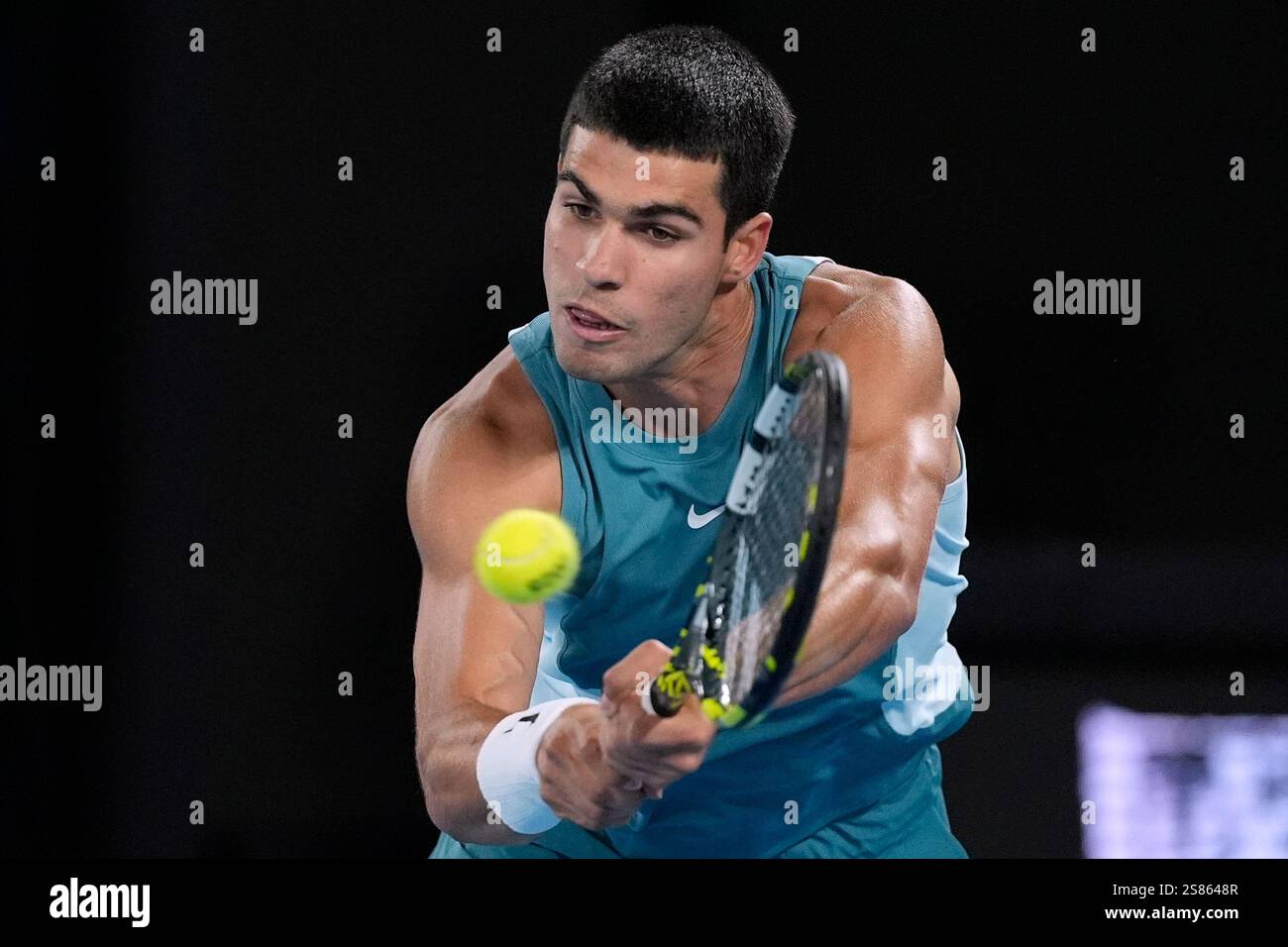 Carlos Alcaraz of Spain plays a backhand return to Novak Djokovic of ...
