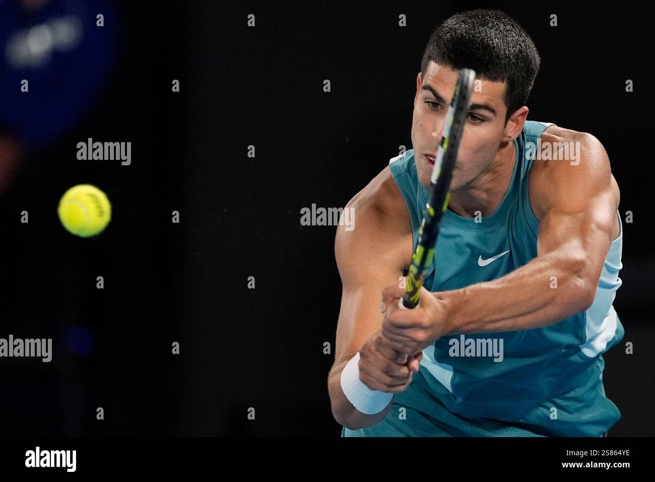 Carlos Alcaraz of Spain plays a backhand return to Novak Djokovic of ...