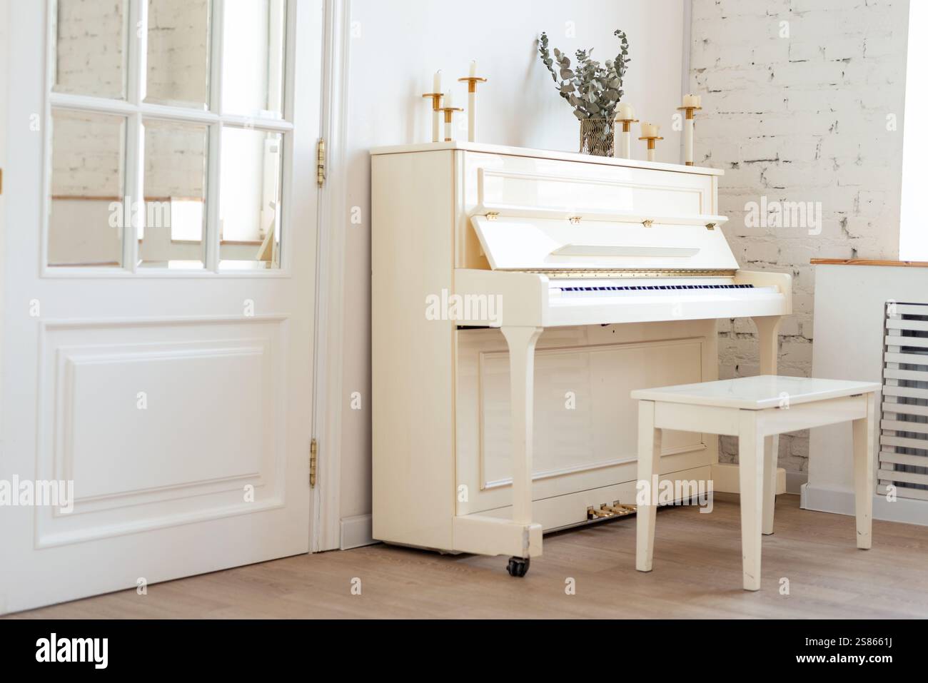 Piano music room natural light with light interior Stock Photo - Alamy