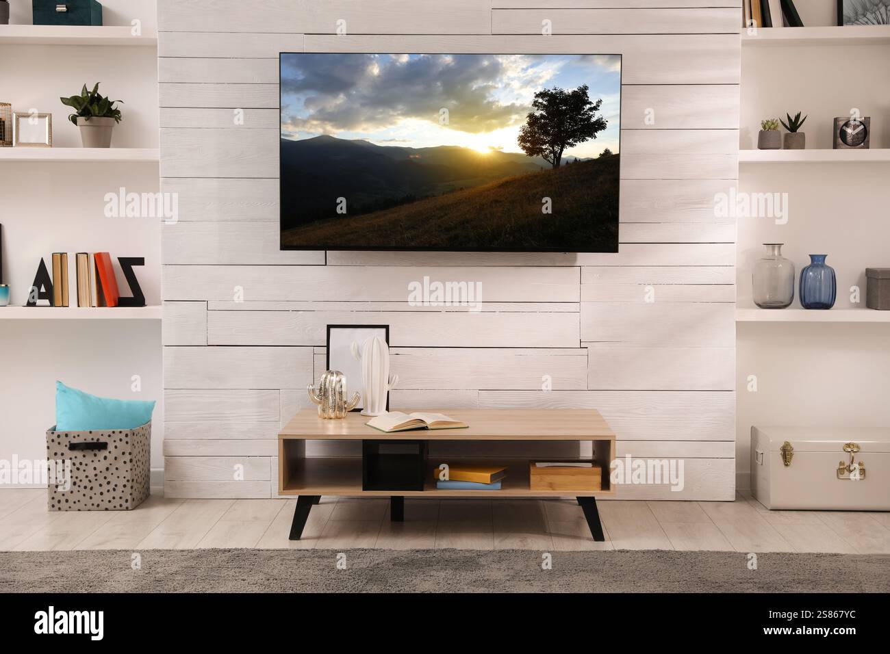 TV set with nature landscape on screen in room Stock Photo - Alamy