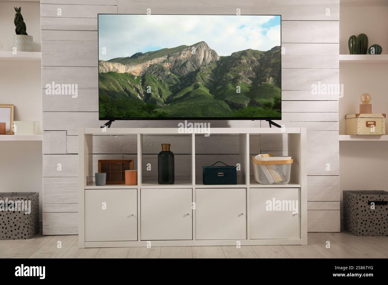 TV set with nature landscape on screen in room Stock Photo - Alamy