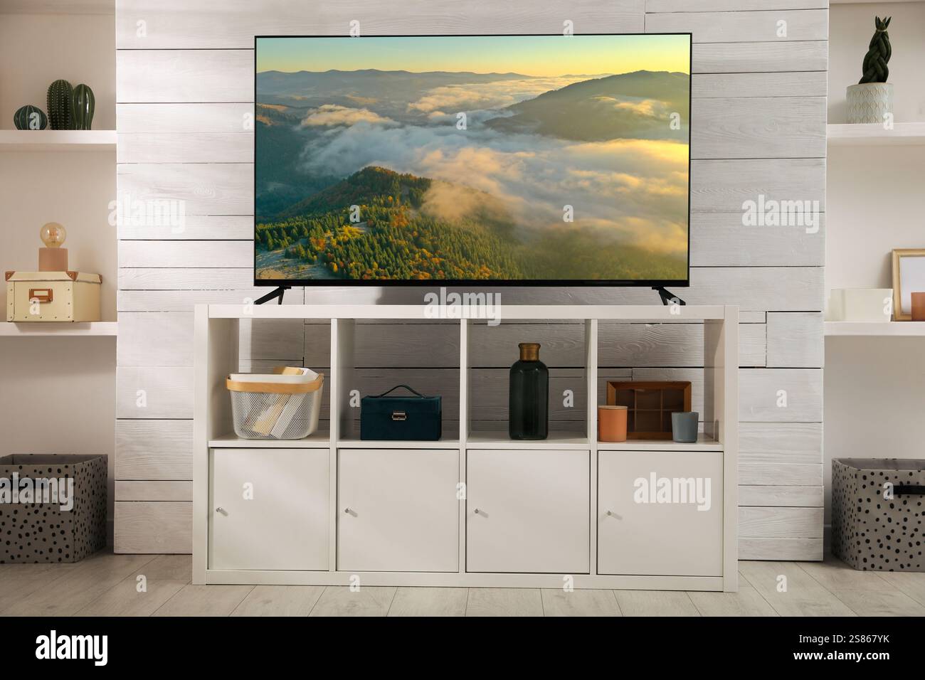 TV set with nature landscape on screen in room Stock Photo - Alamy
