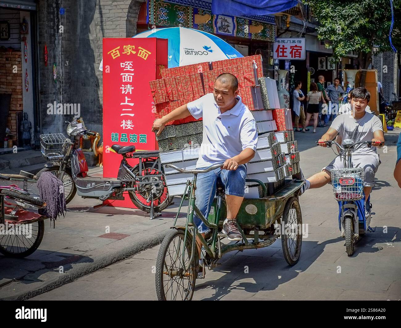 Precarious bicycle transport on the famous he Cultural street of ...