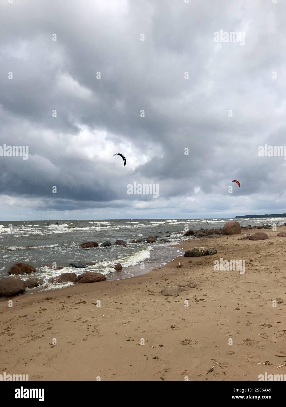 Active Sea shrouded in rocks and boulders. High quality photo Stock ...