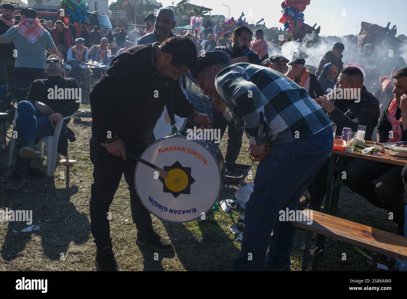 A man accompanying a drummer. Camel wrestling, a legacy of nomadic ...