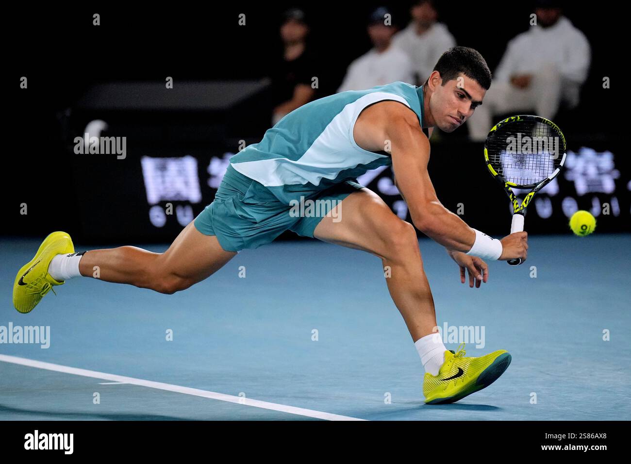 Carlos Alcaraz of Spain plays a backhand return to Novak Djokovic of ...