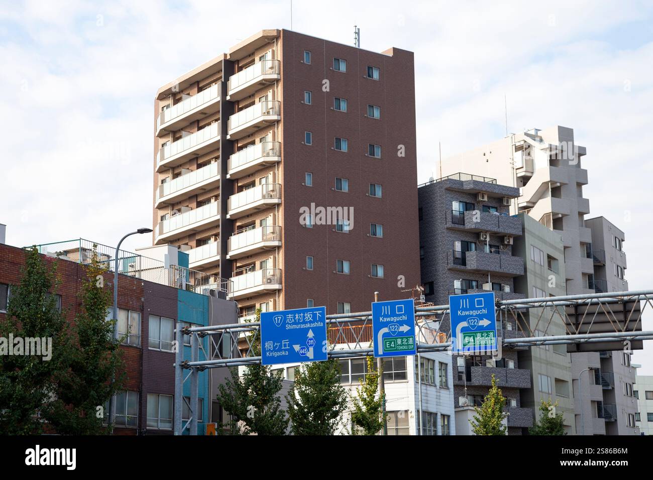 A main road and apartment buildings in the Akabane neighbourhood in ...