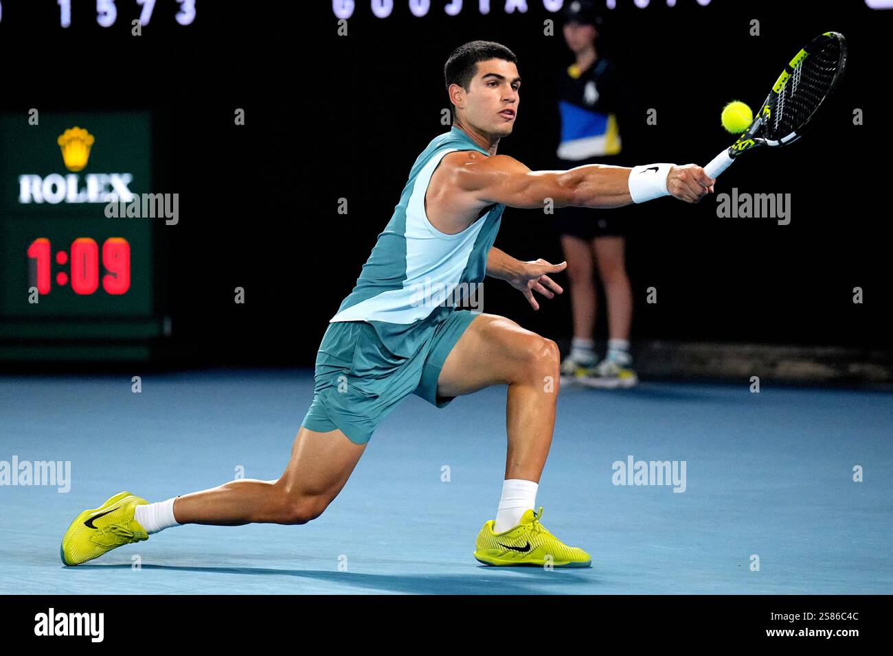 Carlos Alcaraz of Spain plays a backhand return to Novak Djokovic of ...