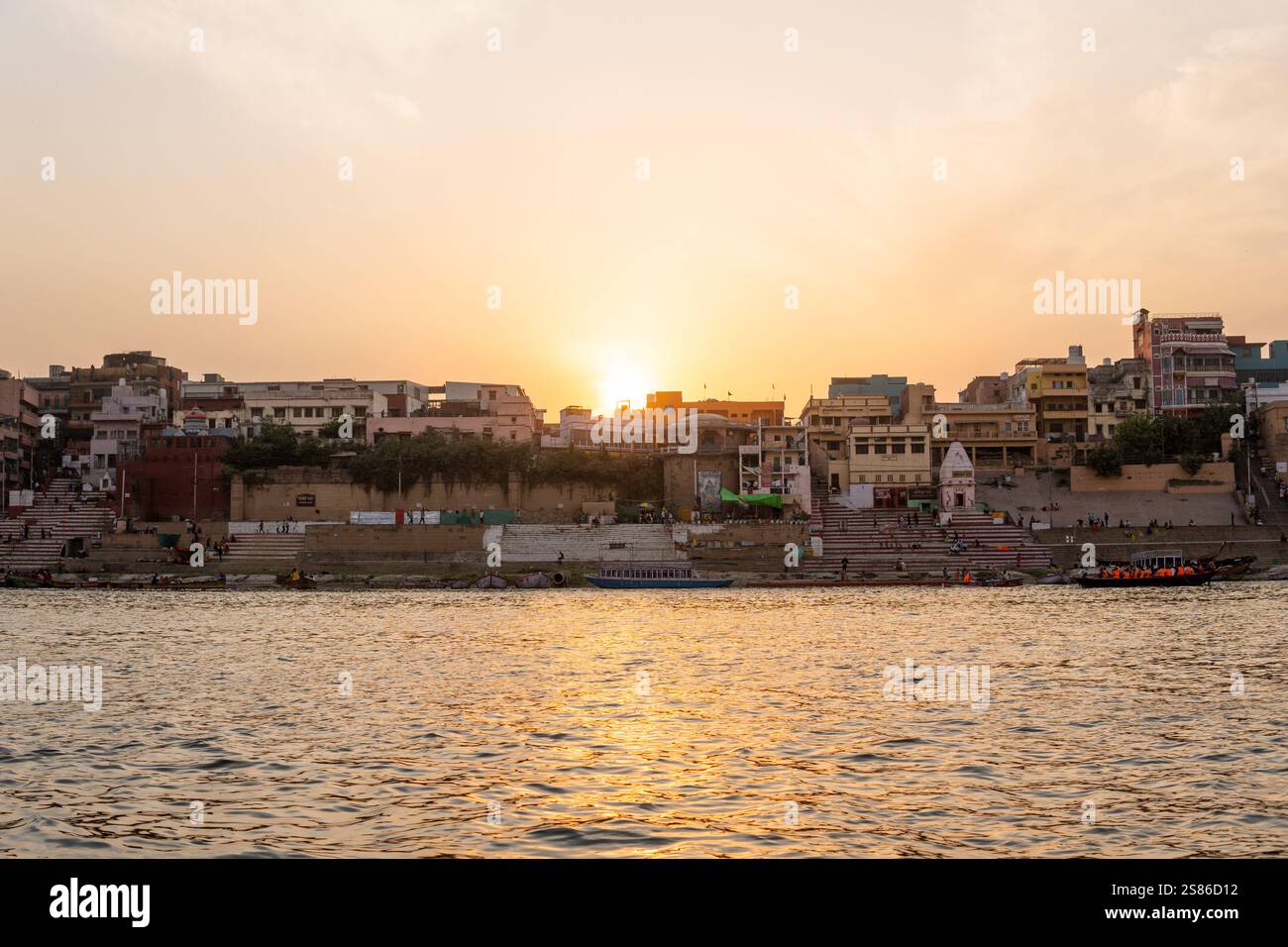 VARANASI, INDIA - APRIL 9, 2024: sunset view over the ancient city of ...