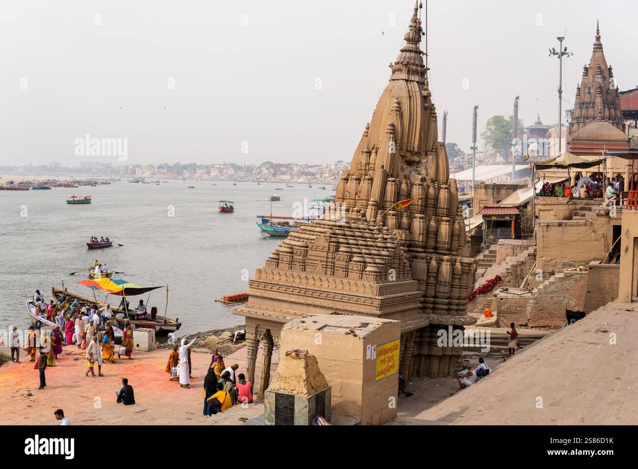 VARANASI, INDIA - APRIL 10, 2024: Ganges river waterfront with old ...