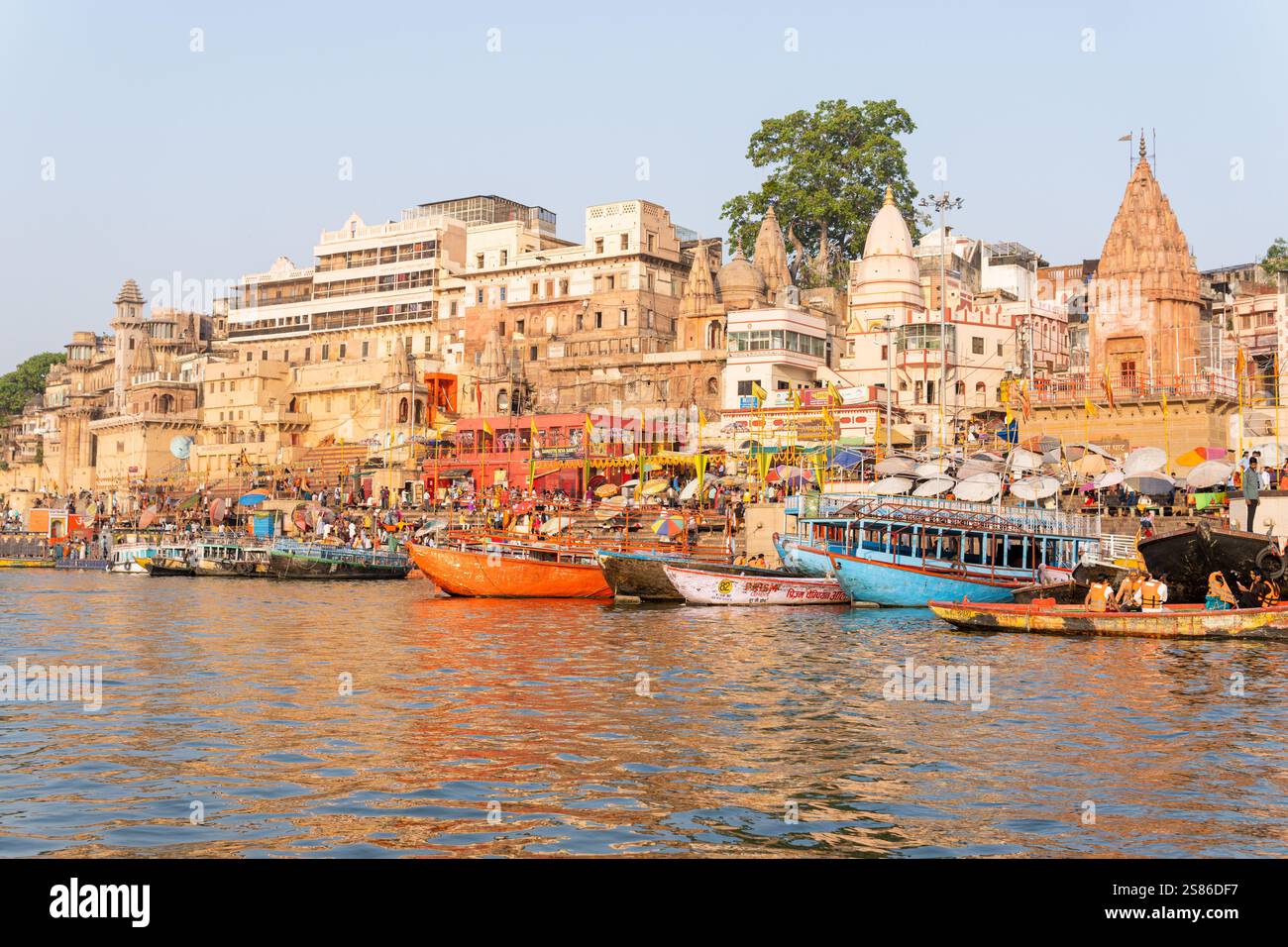 VARANASI, INDIA - APRIL 11, 2024: sunset view over the ancient city of ...