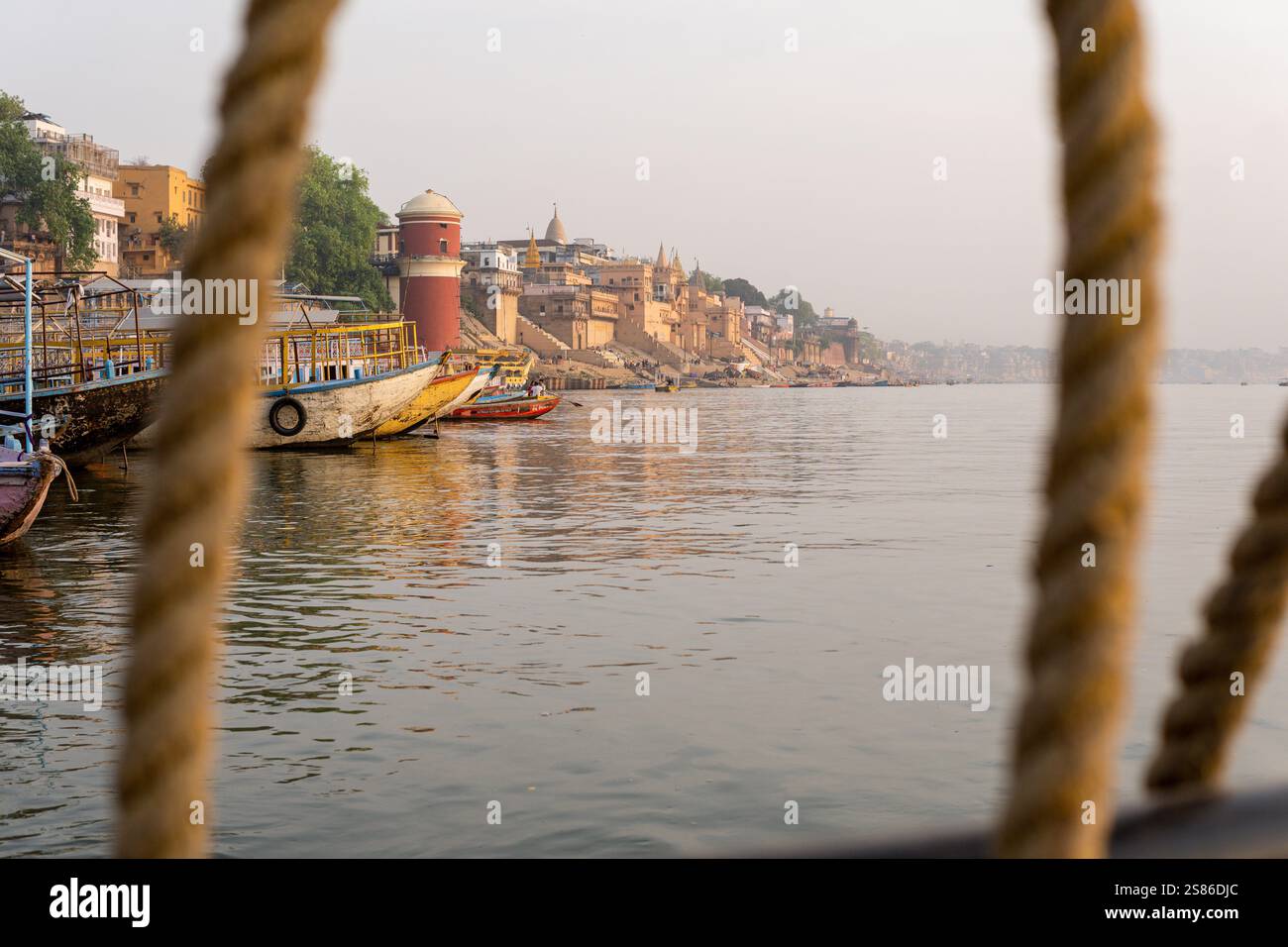 VARANASI, INDIA - APRIL 11, 2024: sunset view over the ancient city of ...