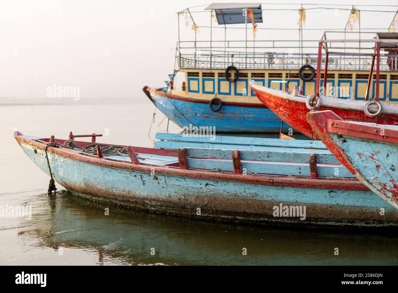 Old wooden boats on the Ganges river in Varanasi, India Stock Photo - Alamy