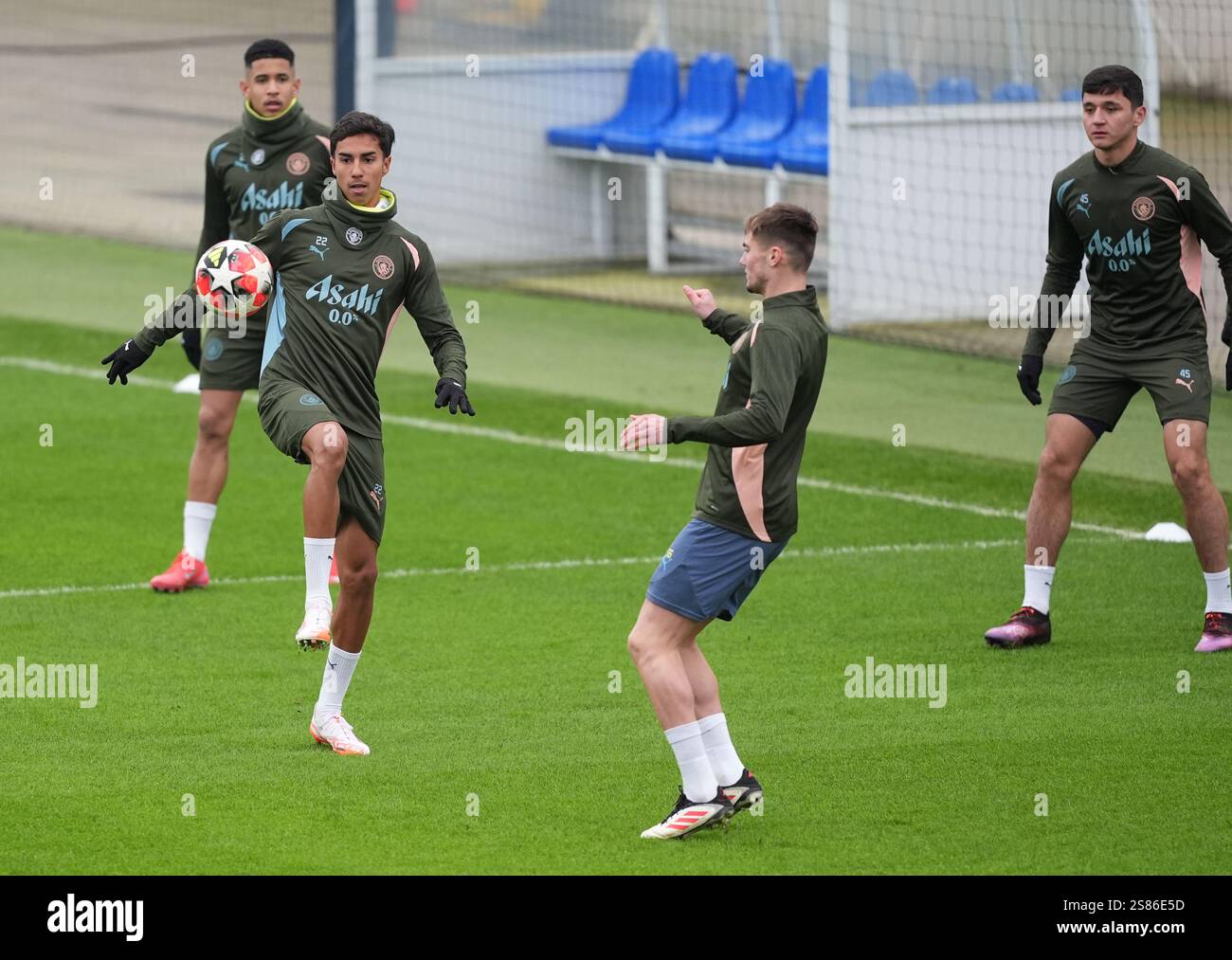 Manchester City's Vitor Reis (left) and Abdukodir Khusanov (far right ...
