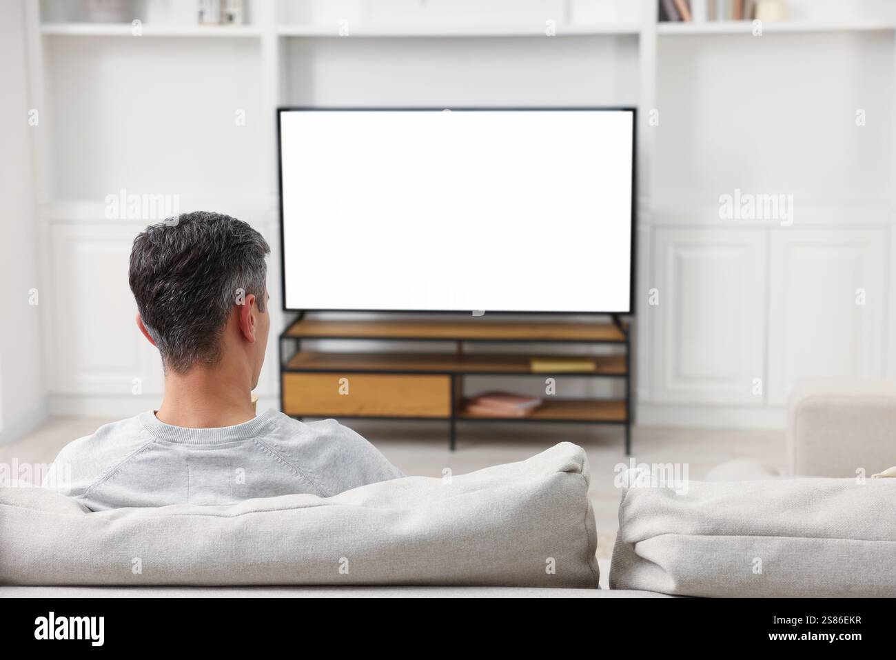 Back view sofa tv hi-res stock photography and images - Alamy