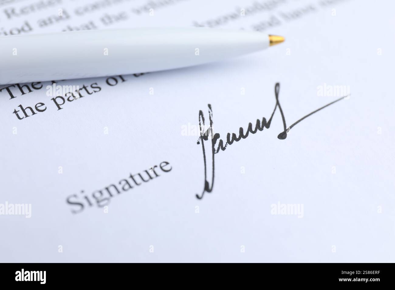 Ballpoint pen and signature on contract, closeup Stock Photo - Alamy