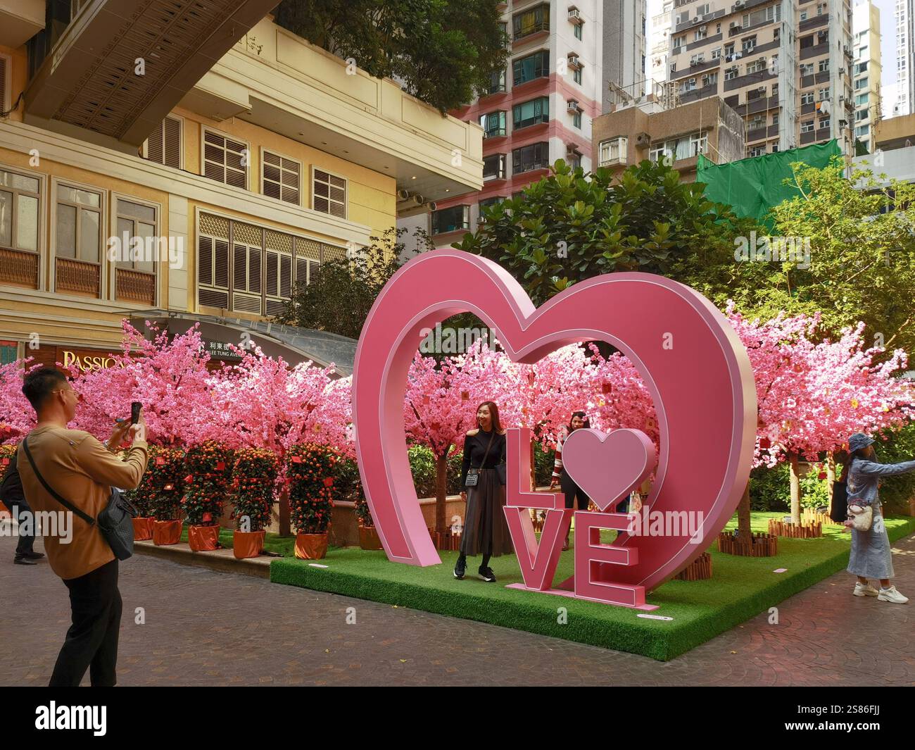HongKong, China - January 21, 2025 : A vibrant pink heart installation ...
