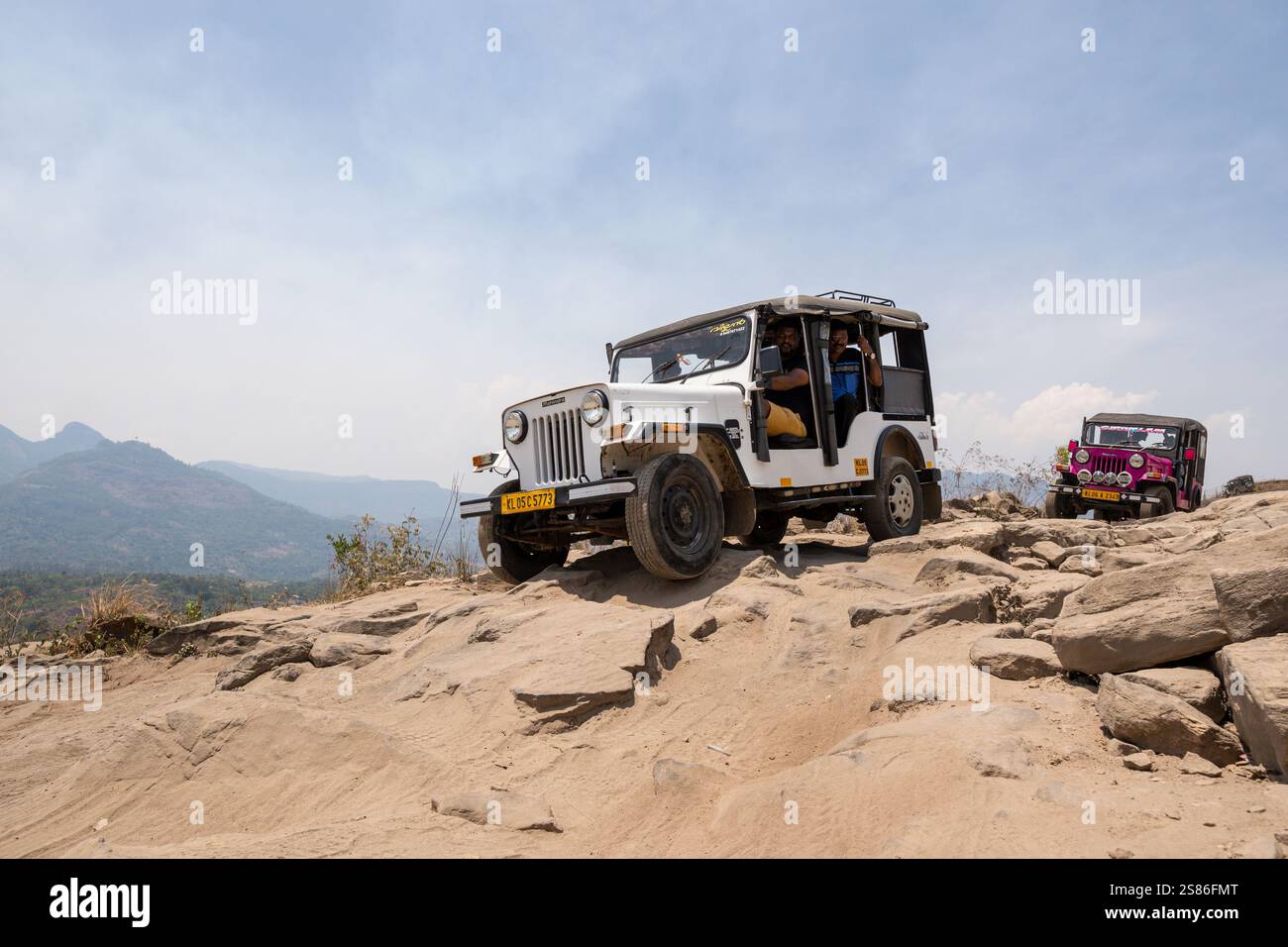 MUNNAR, INDIA - MAY 1, 2024: off-road jeep safari tour cars driving ...