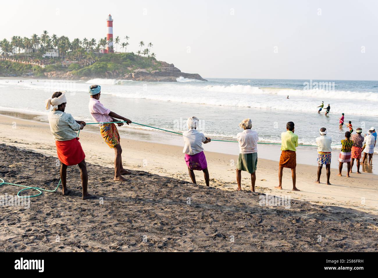 KOVALAM, INDIA - MAY 8, 2024: Traditionally dressed Indian fisherman ...