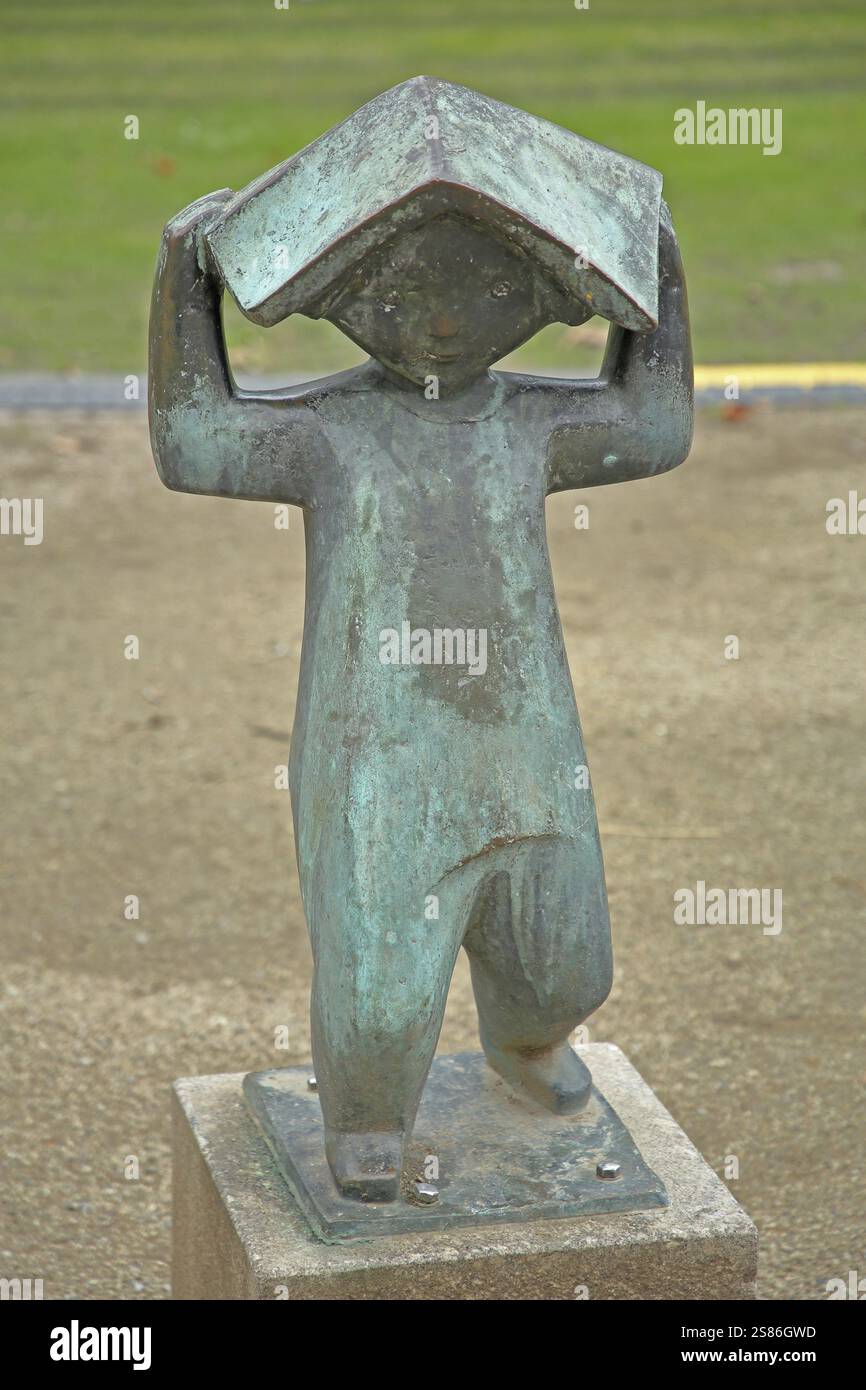 Sculpture Rainman by Kurt Lehmann 1953, child with book over his head ...