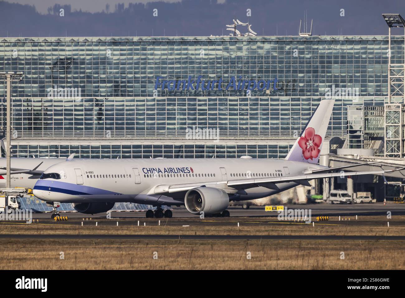 Aircraft in front of the terminal with the signFrankfurt Airport at Fraport Airport. Aircraft ...