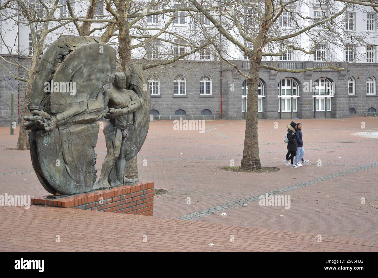 Sculpture Man in a circle by Eberhard Linke 1988, male figure with long ...