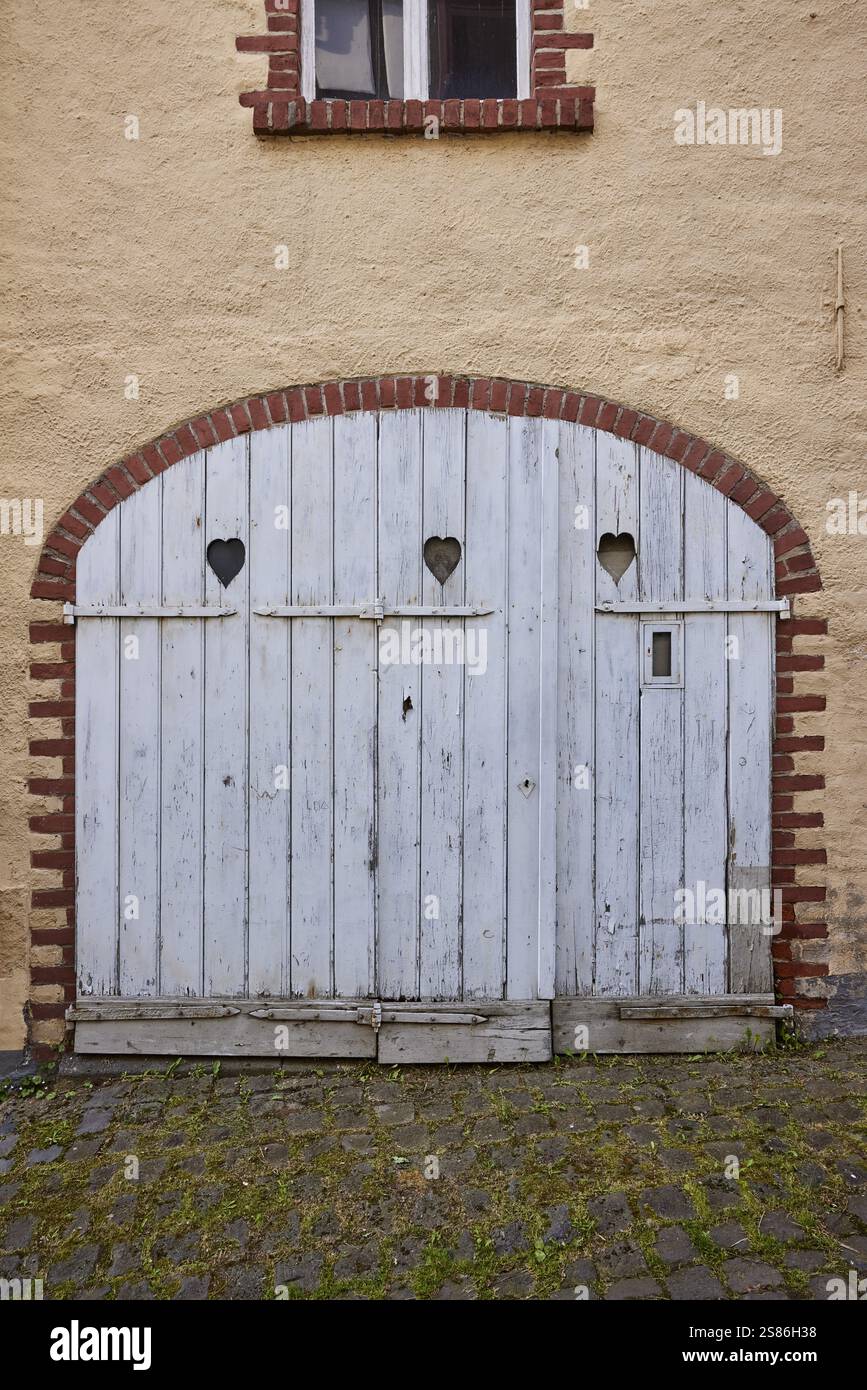 Historic buildings, facade, gate, wooden gate, heart-shaped cut-outs ...