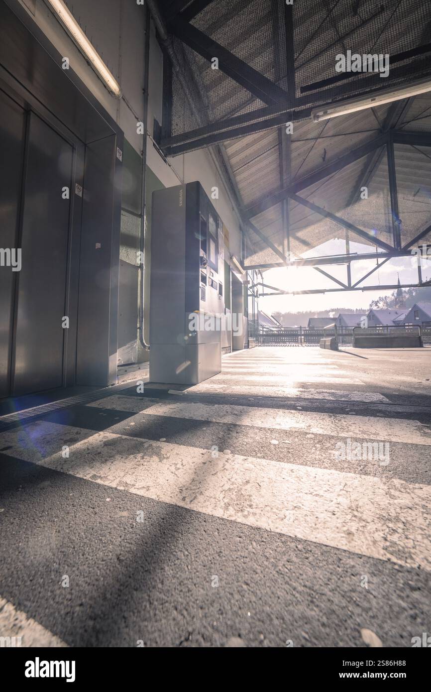 Bright entrance area of a building with light beams and steel girders ...