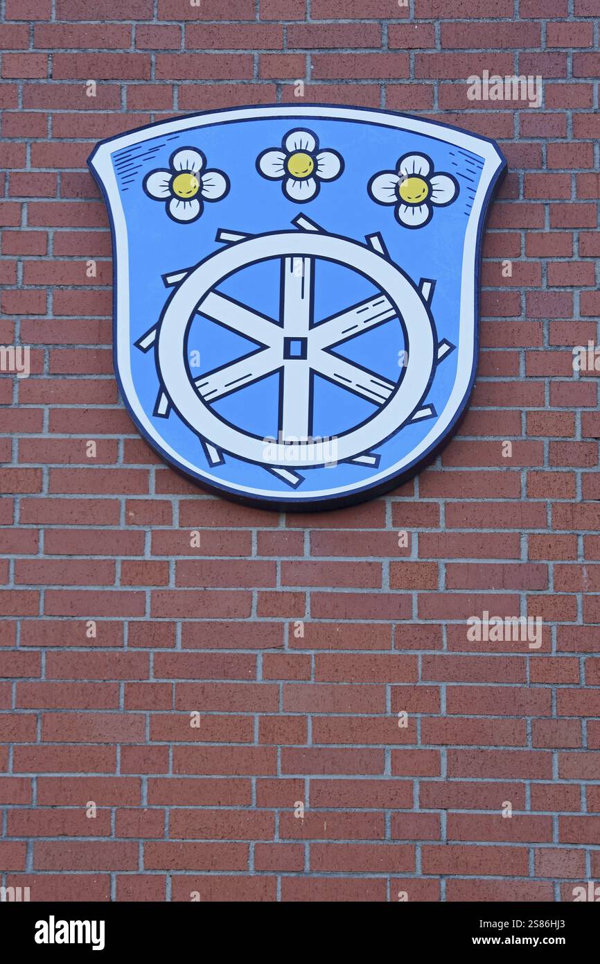 Blue town coat of arms, white mill wheel with three flower figures, red ...